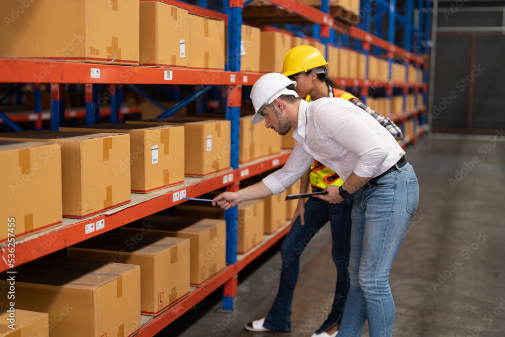 Supervisor and manager smiling happy holding laptop computer on hand ...