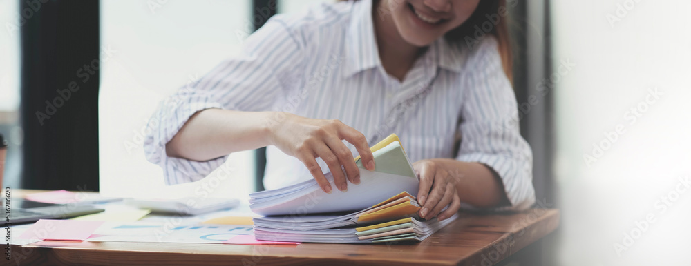 Business Documents concept : Employee woman hands working in Stacks ...