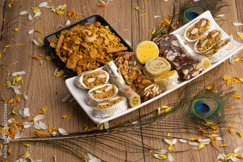 Mix indian sweets like kaju roll dryfruits barfi mango peda served in a ...