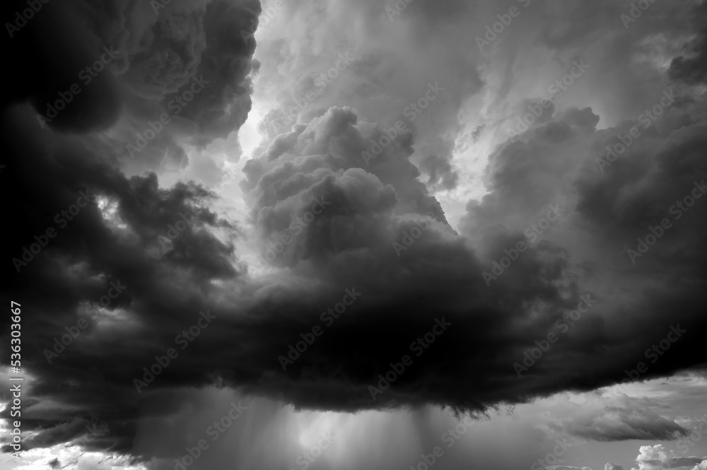 Dark sky and dramatic black cloud before rain.A tropical cyclone is a ...