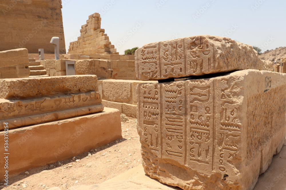 Ancient egyptian hieroglyphs carved on stone at Isis temple in Aswan ...