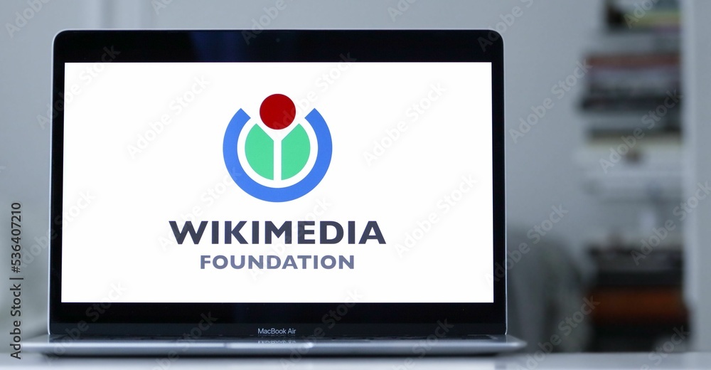 Laptop displaying the logo of the Wikimedia foundation a free online ...