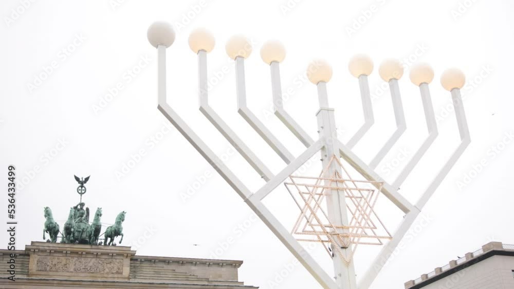 Jews celebrate Hanukkah by burning menorahs with traditional ...