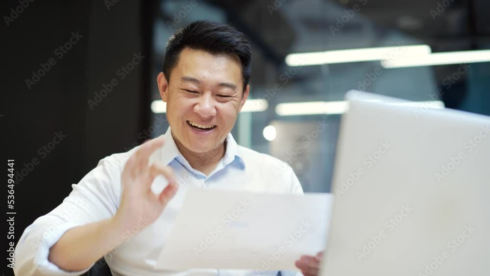 Portrait happy asian guy business men employee reading documents report ...