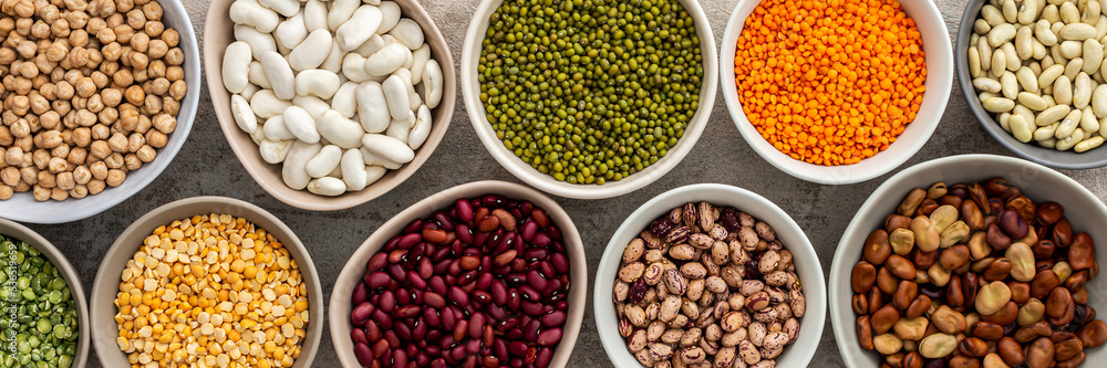 Banner of different types of legumes in bowls, yellow and green peas ...