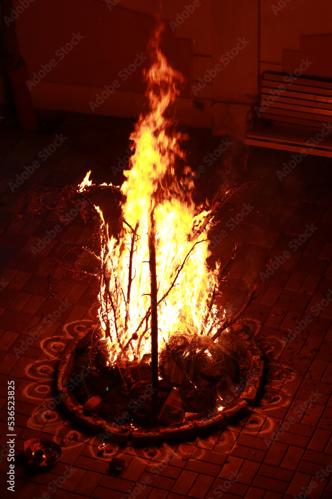 Holika Dahan a large wood fire during Holi or lohri festival Stock ...