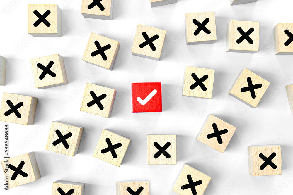 Check mark on cube wooden toy block with cross symbol for true or false ...