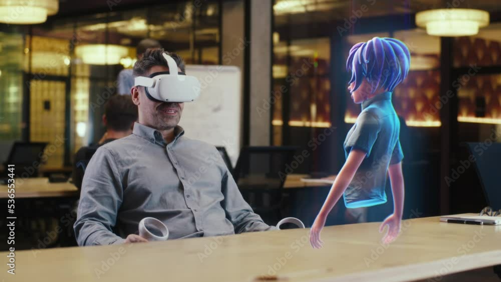 A man with virtual reality glasses uses a joystick to connect the video ...