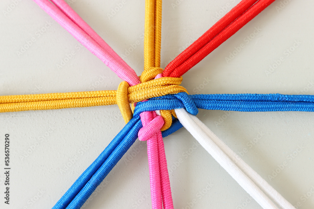 Concept image of unity and teamwork. Ropes tied together as a symbol of ...