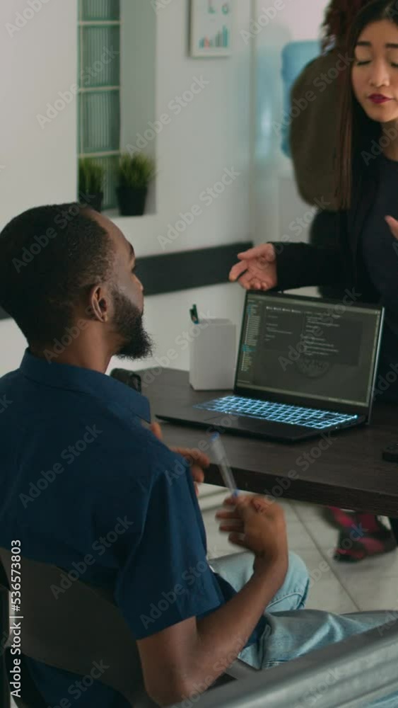 Vertical video: Diverse coders talking about source code on terminal ... Vertical video: Diverse coders talking about source code on terminal ...