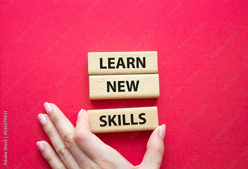 Learn new skills symbol. Concept words Learn new skills on wooden ...