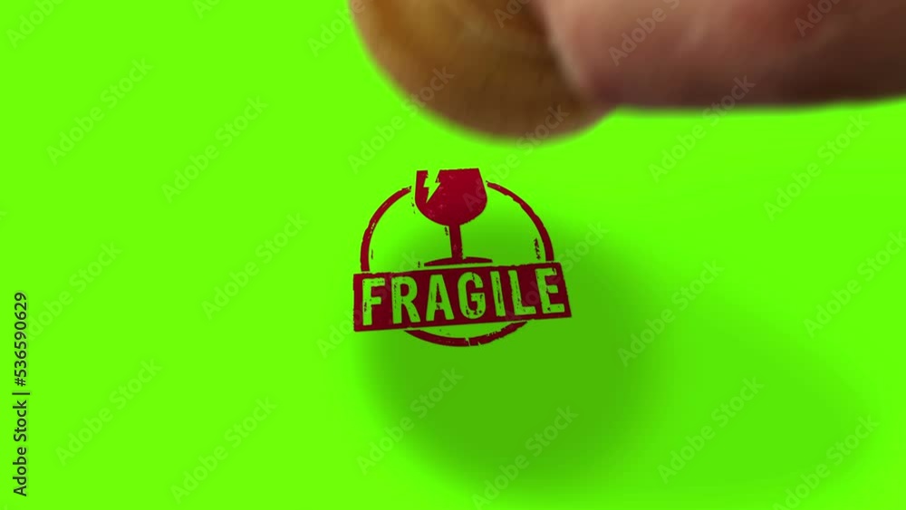 Fragile stamp and hand stamping impact isolated animation. Careful ...