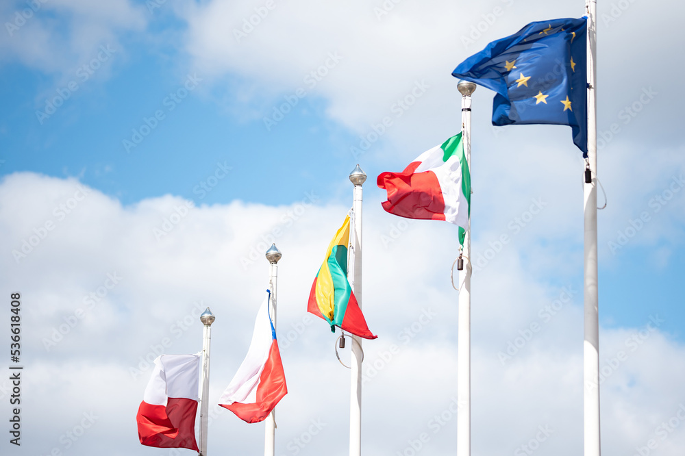 European flags are hoisted on masts and fluttering in the wind ...