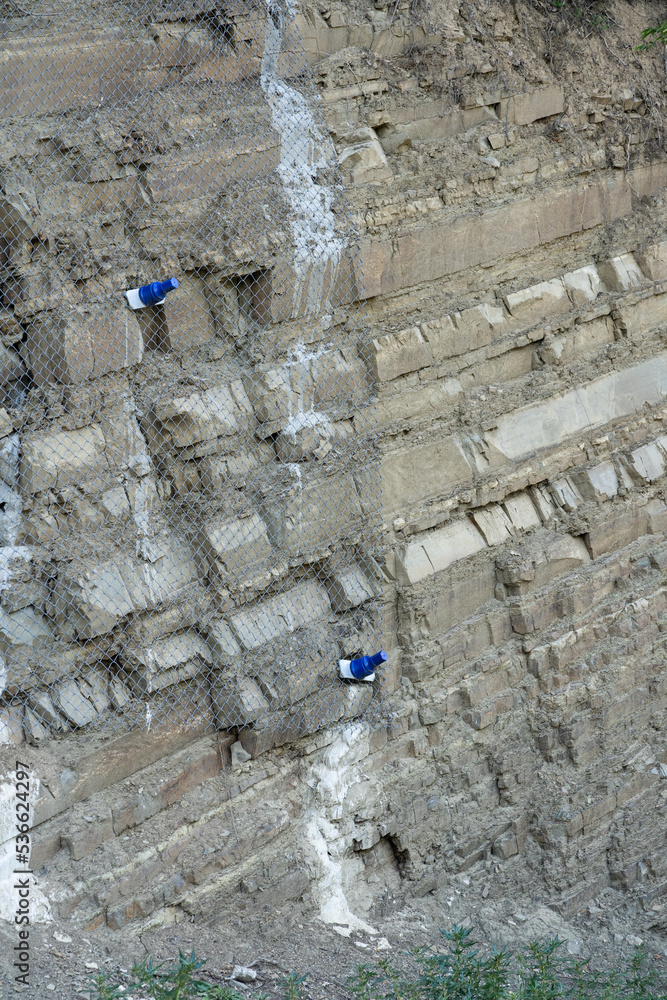 Reinforcing mountain slope with metal mesh and concrete reinforcement ...