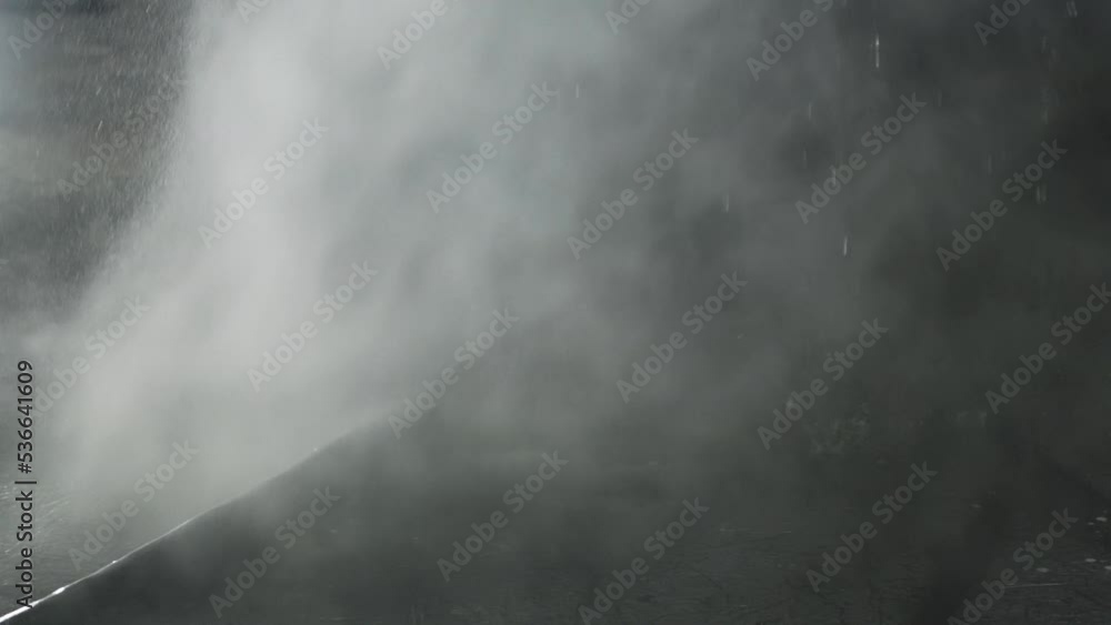 Water is splashing from the industrial machine at manufacturing. Water ...