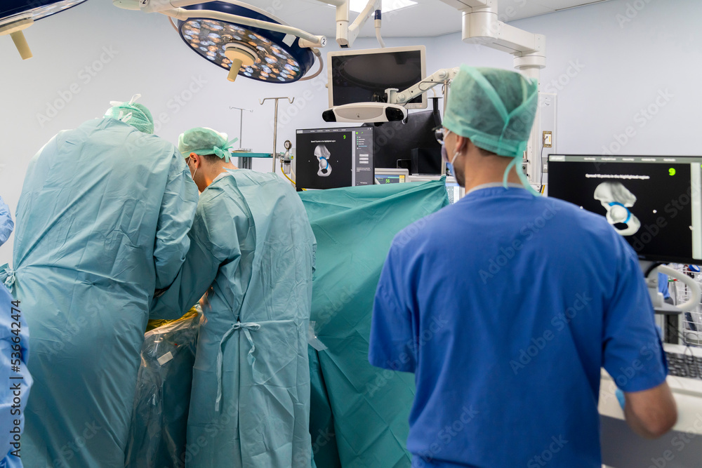 Team of doctor perform total hip arthroplasty replacement surgery in ...