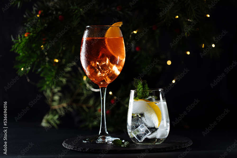 Cocktail called Aperol spritz and gin tonic or Moscow mule in dark ...
