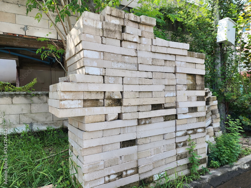 LIGHTWEIGHT CONCRETE stacked piles in front of the construction site ...