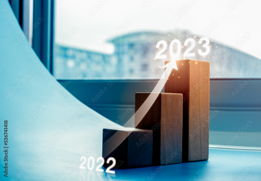 Shining rise up arrow on wood blocks chart steps as a graph from year ...