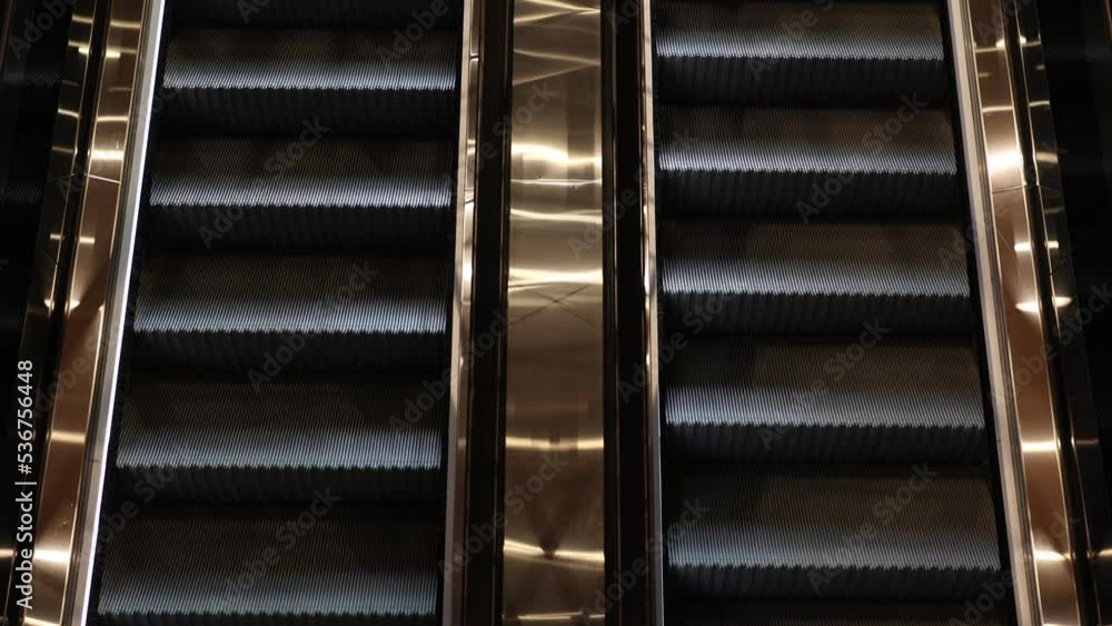 Escalators in the modern building. Up and down movement of escalator 4k ...