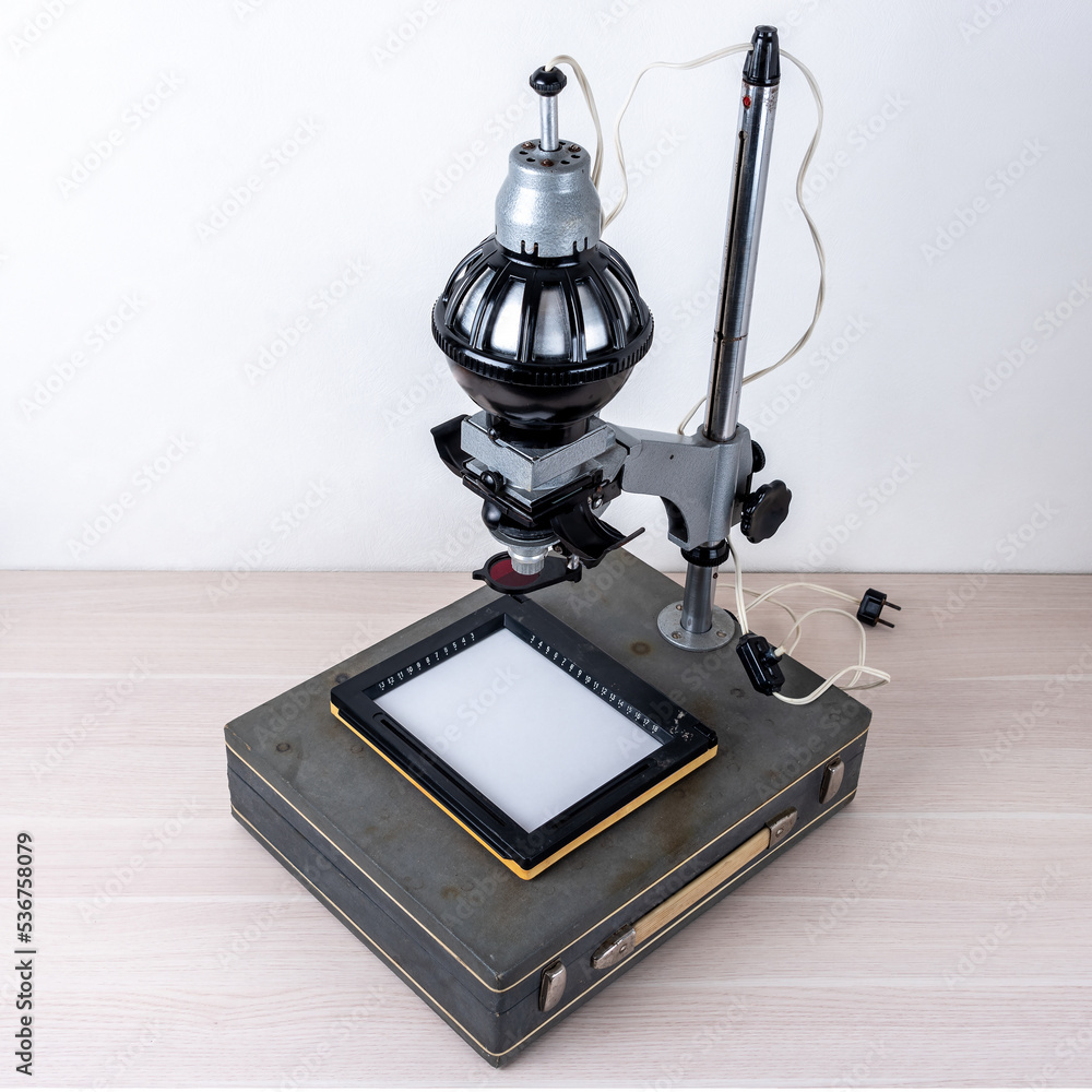 Antique photographic enlarger (1967) with a case as object table. Stock ...