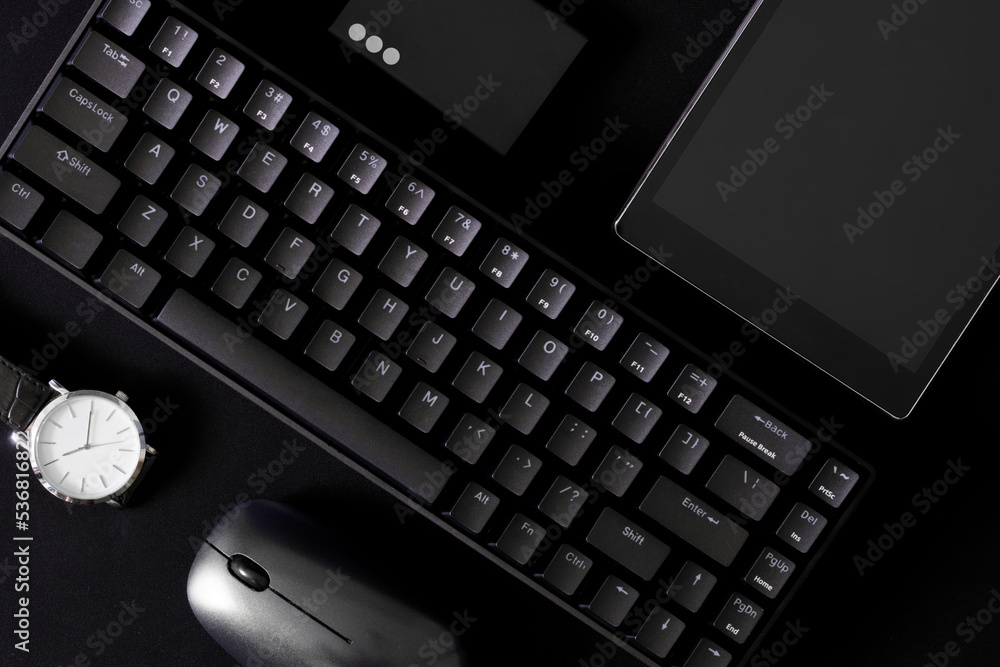 Small mechanical computer keyboard with 68 keys on a black background ...