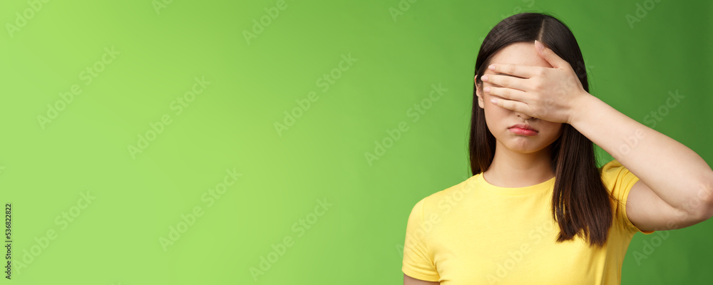 Sad tired asian girl dark haircut, shut eyes hold hand sight, grimacing ...