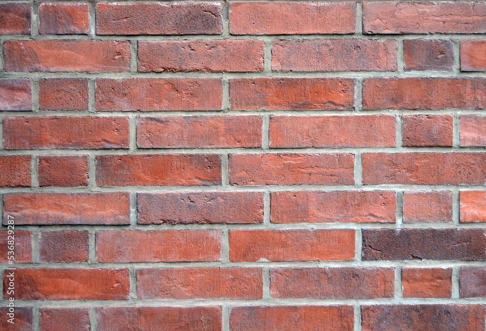 Red brick wall background close-up. Even red and brown bricks. Texture ...