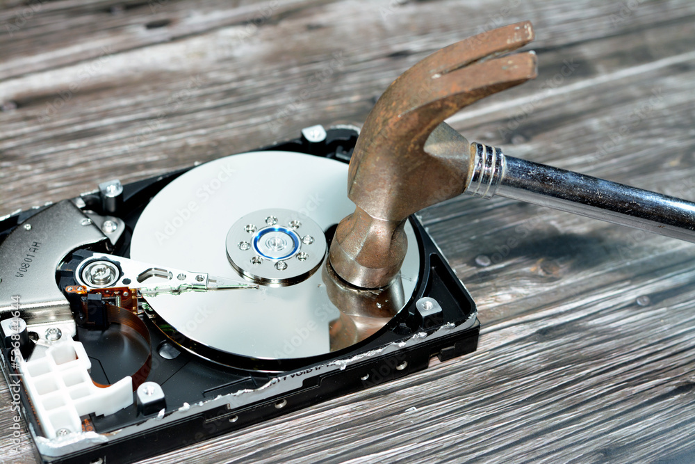 A steel hammer on HDD platters and spindle motor, hard disk drive ... A steel hammer on HDD platters and spindle motor, hard disk drive ...