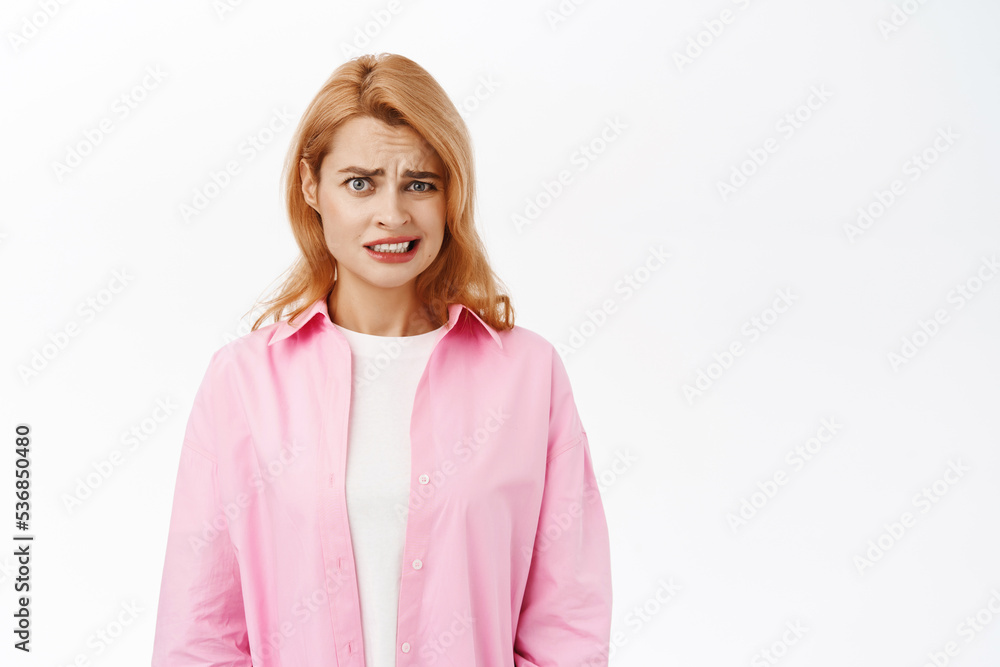 Yikes, thats awful. Young woman grimaces from cringe and disgusting ...