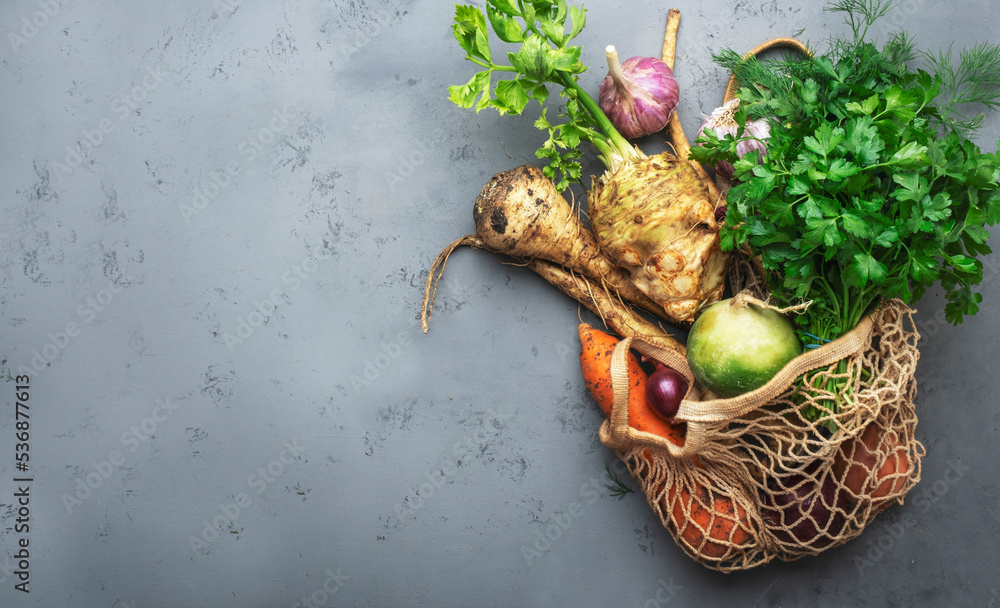 Autumn food background with vegetables, root crops in string bag ...