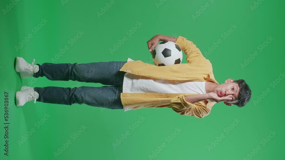 Full Body Of Asian Boy With A Ball Making Fun Of The Losers By Ooh Face ...