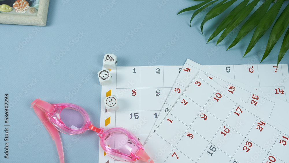 A calendar with pool goggles. Concept - planning time and daily ...
