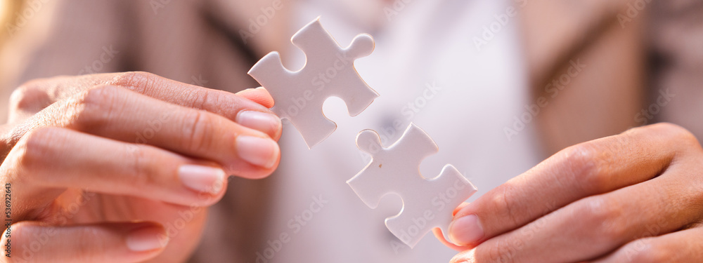 Concept of integration and startup with puzzle pieces merger with ...