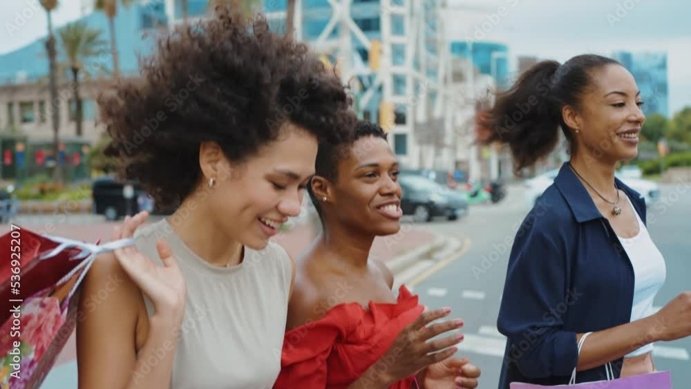 Beautiful young women spending time together and having fun. Latin and ...