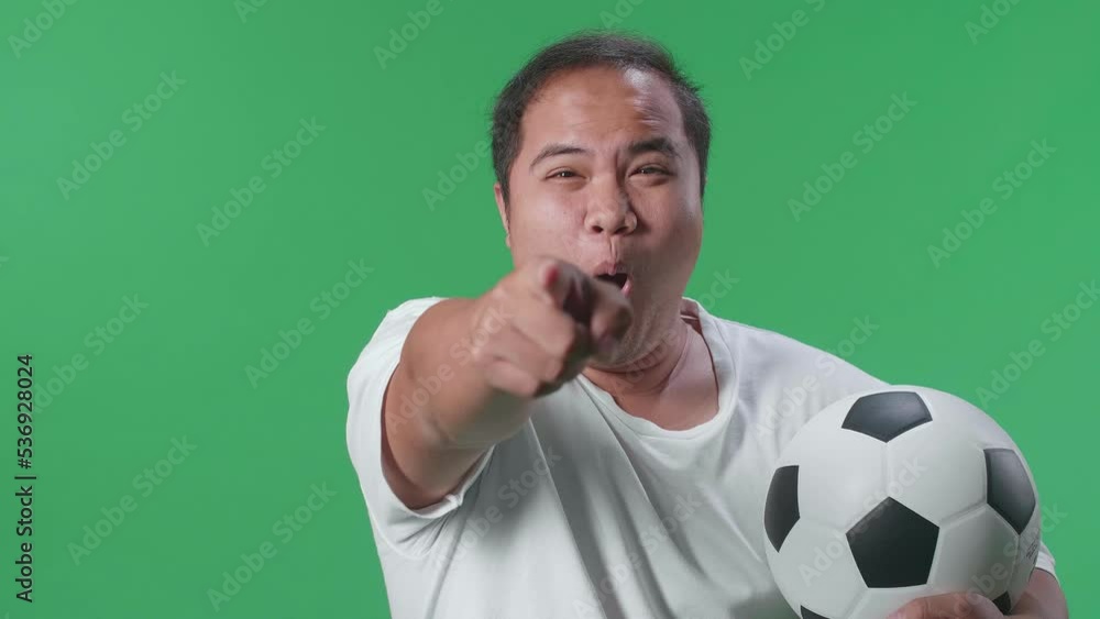 Close Up Of Asian Man With A Ball Pointing For Making Fun Of The Losers ...