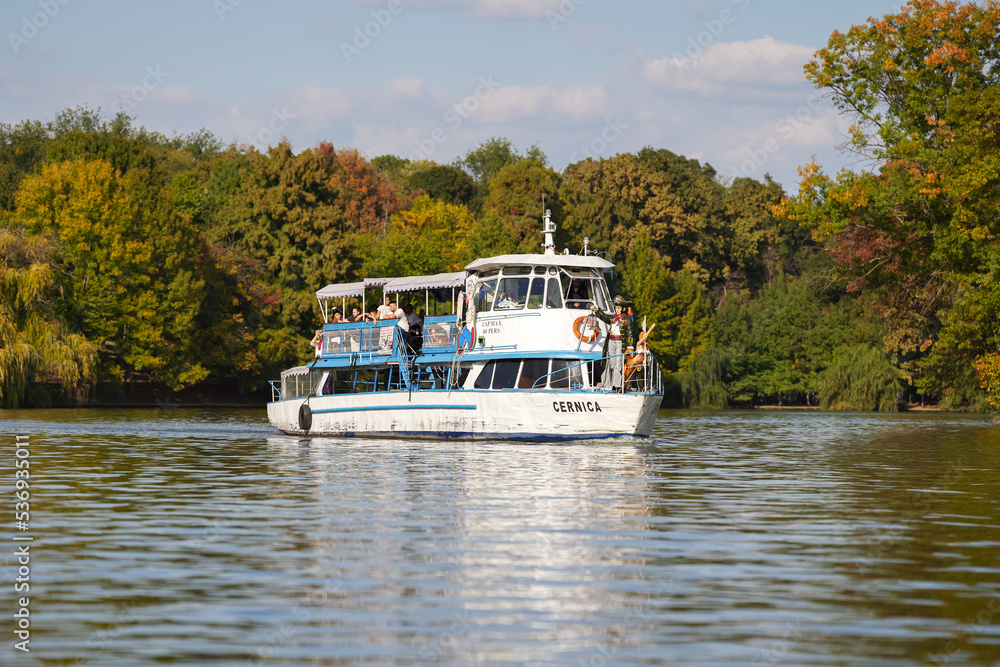 Boat cruise on Herastrau Lake from Bucharest. People on a boat cruising ...