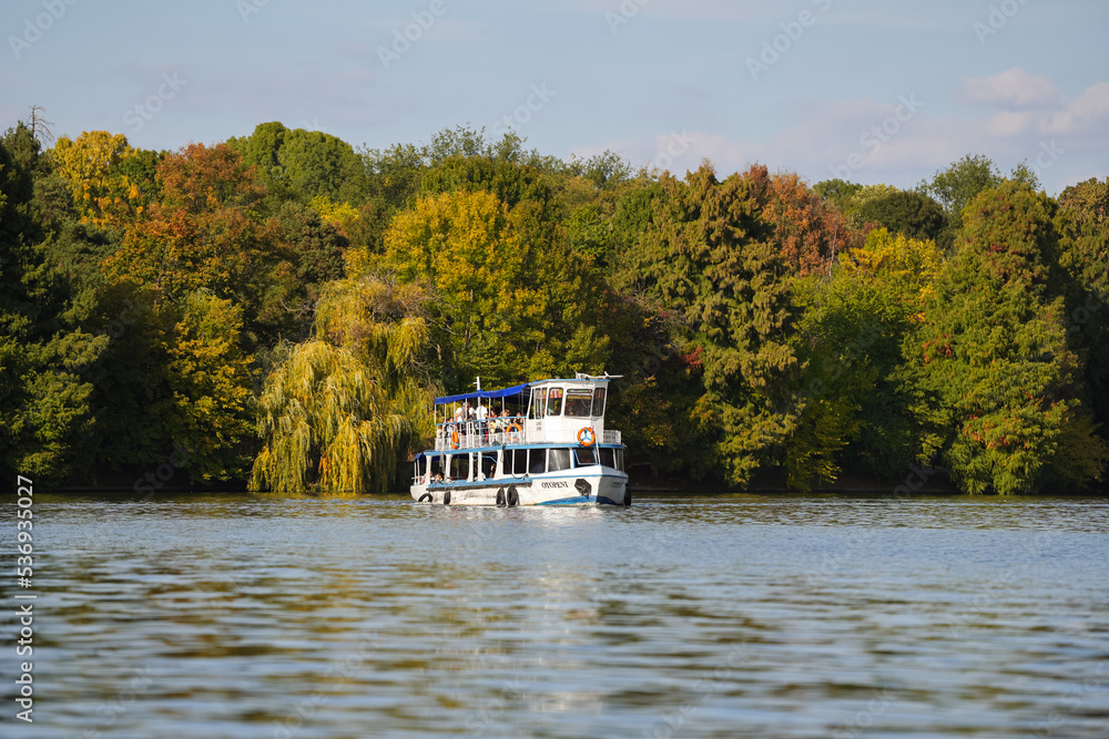 Boat cruise on Herastrau Lake from Bucharest. People on a boat cruising ...