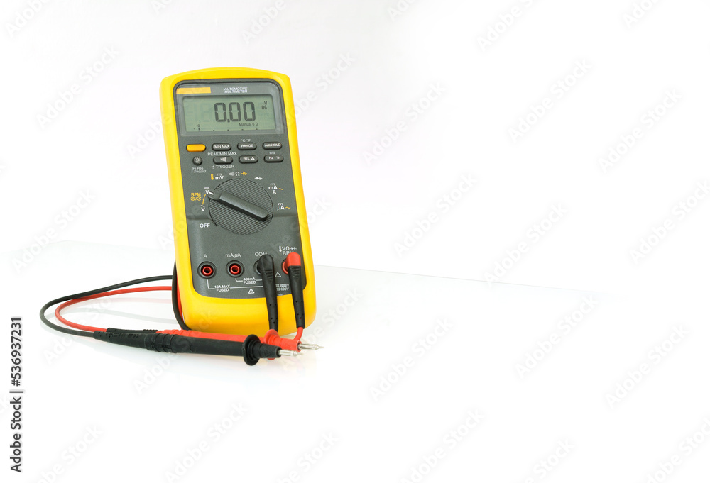 Yellow Digital multimeter with probes on white background , A ...
