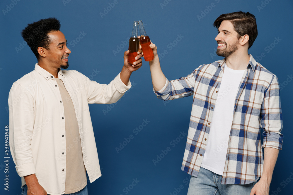 Side view young two friend happy cheerful fun men wear casual shirts ...