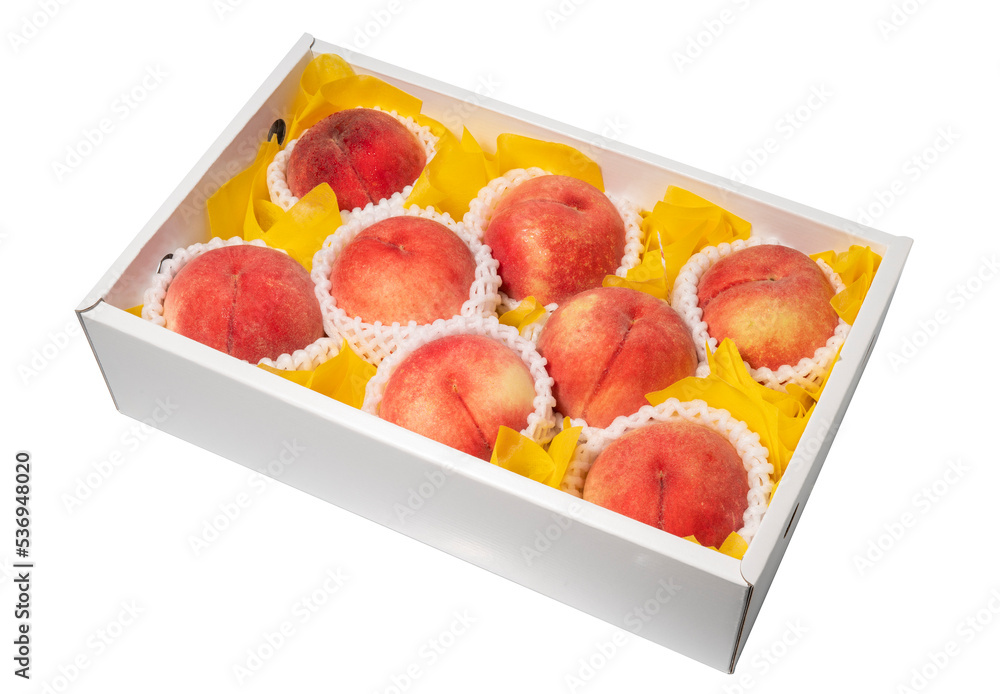 Peach fruit in packaging ready to export isolated on white background ...