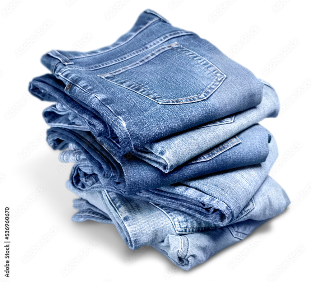Pile of blue jeans over white background Stock Photo | Adobe Stock
