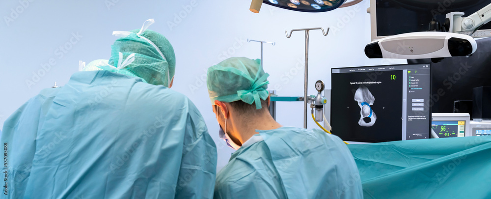 Team of doctor perform total hip arthroplasty replacement surgery in ...