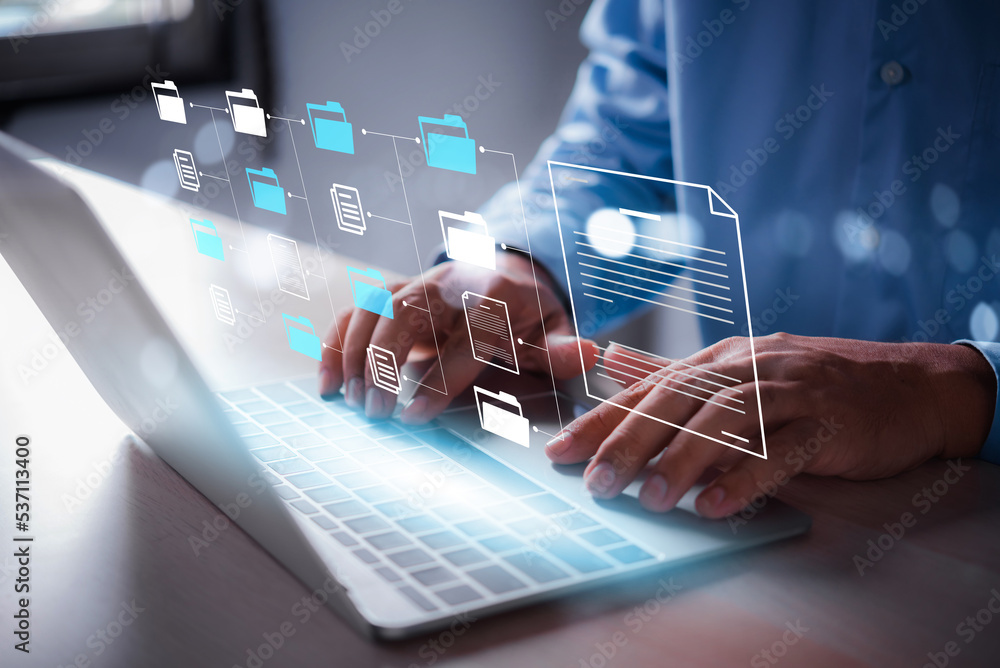 business man using laptop access files document on viritual screen ...