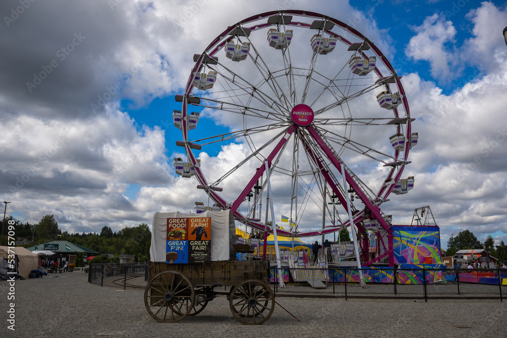 2022-09-16 A FUNTASTIC FERRIS WHEEL AND COVERED WAGON IN FRONT OF ...