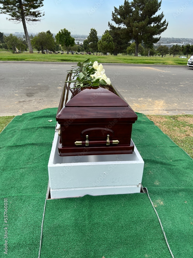 funeral casket coffin waiting to be lowered into the grave Stock Photo ...