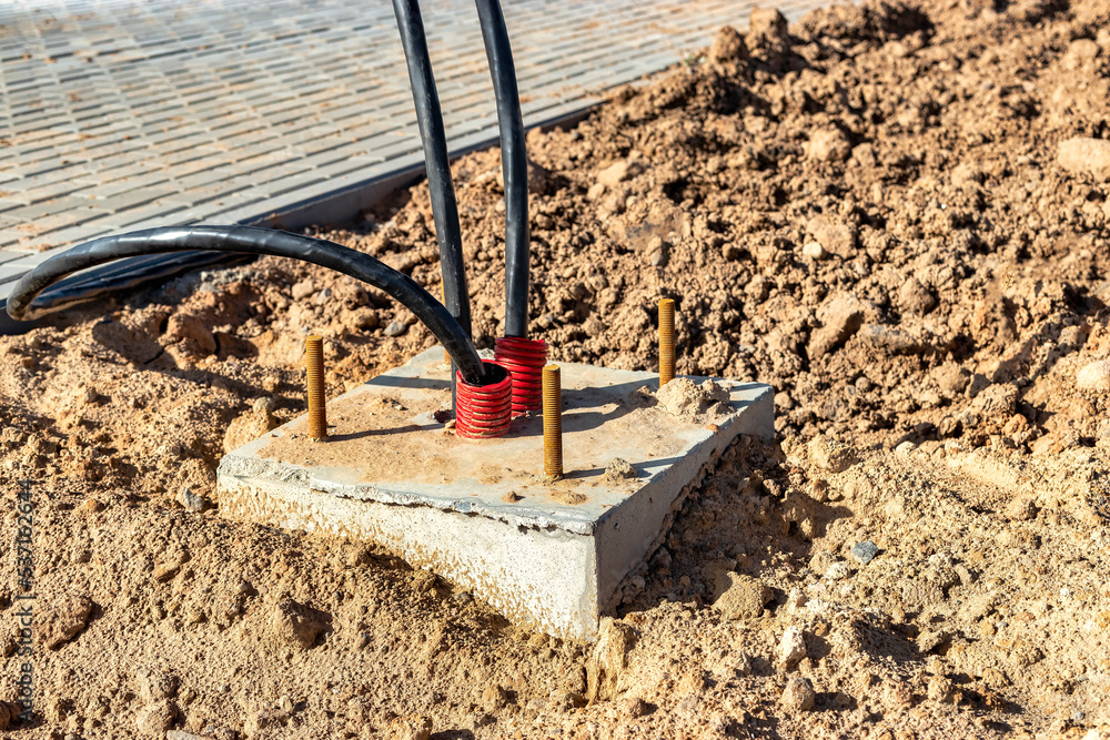 The ends of the electrical cable in the trench. electrical cable ...