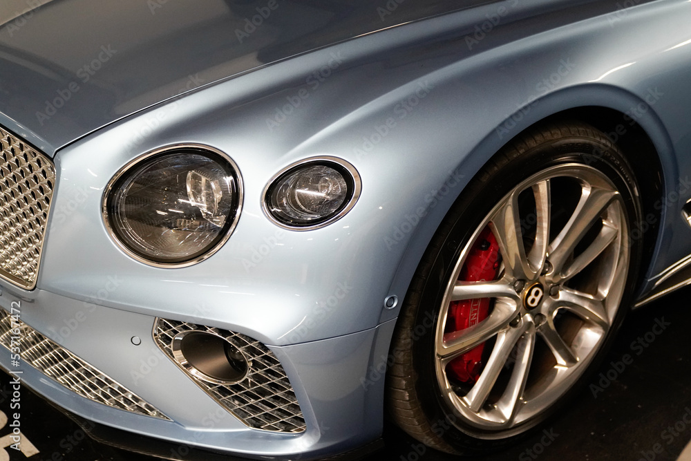 Bentley logo text sign chrome emblem headlight and front wheel of ...