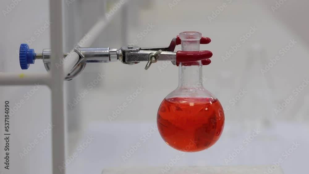 Mixing colored solution with a magnetic stirrer. Formation of a ...