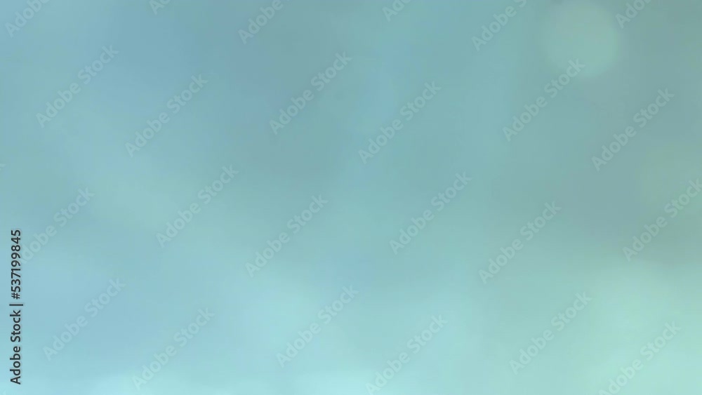 Defocused white lens flare on dark abstract background. Spotlight rays ...